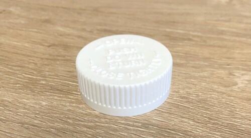 38-400 White Child-Resistant Push Down & Turn Caps | Kaufman Container